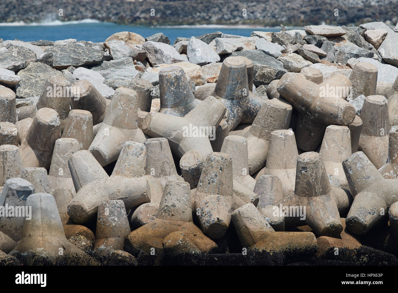 Beach of Sea with triangle artificial stones. Defense against sea power ...