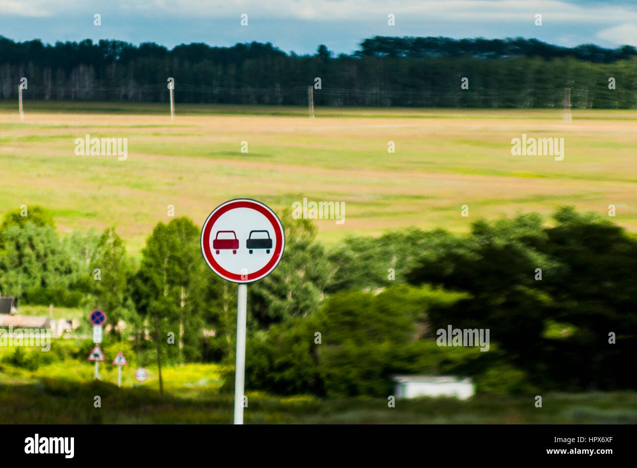 road sign overtaking prohibited installed on the highway Stock Photo ...