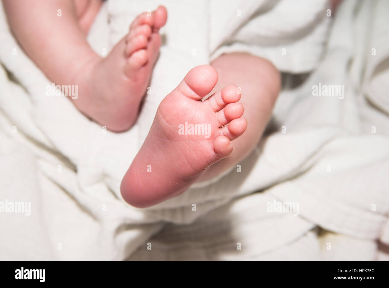 New born baby feet Stock Photo - Alamy