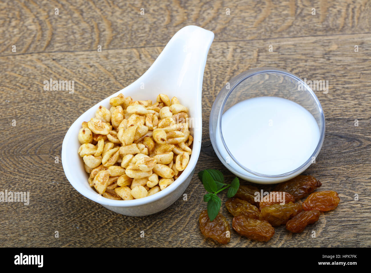 Rise flakes with milk, raisin and mint leaves Stock Photo - Alamy