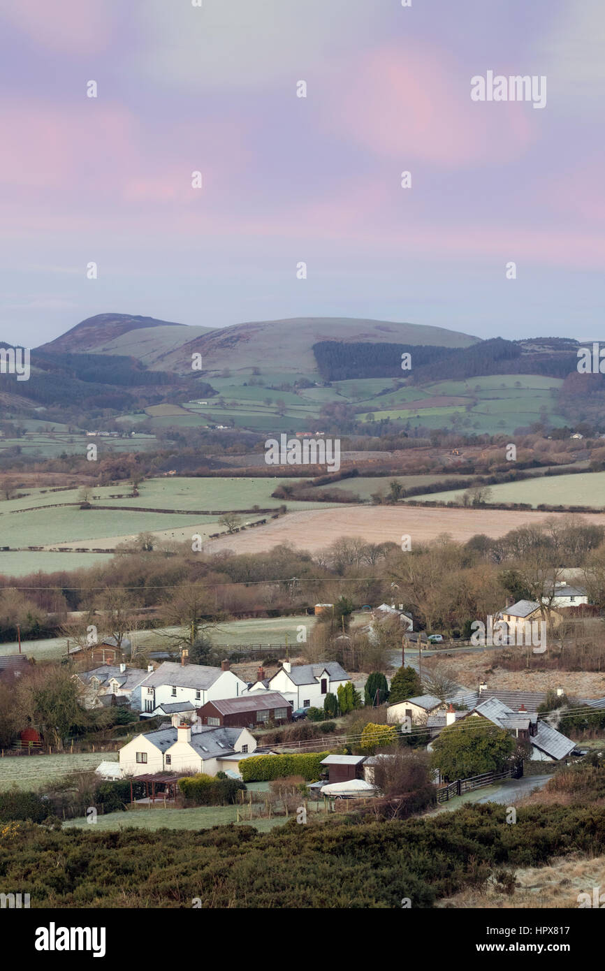 A cold morning sunrise over the Clwydian Range and Moel Arthur in North ...