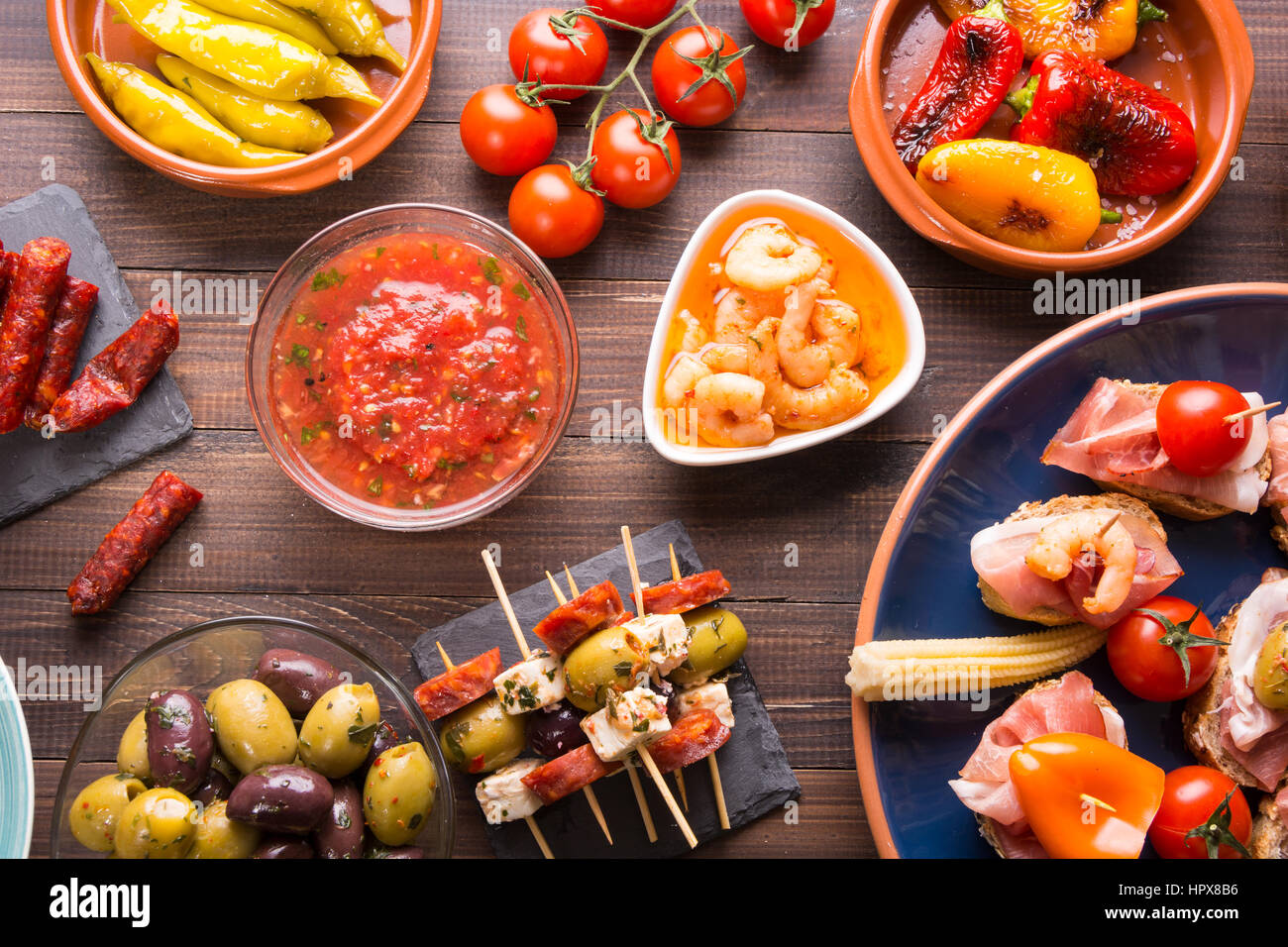 Top view of variety of mediterranean starters - spanish tapas with ...