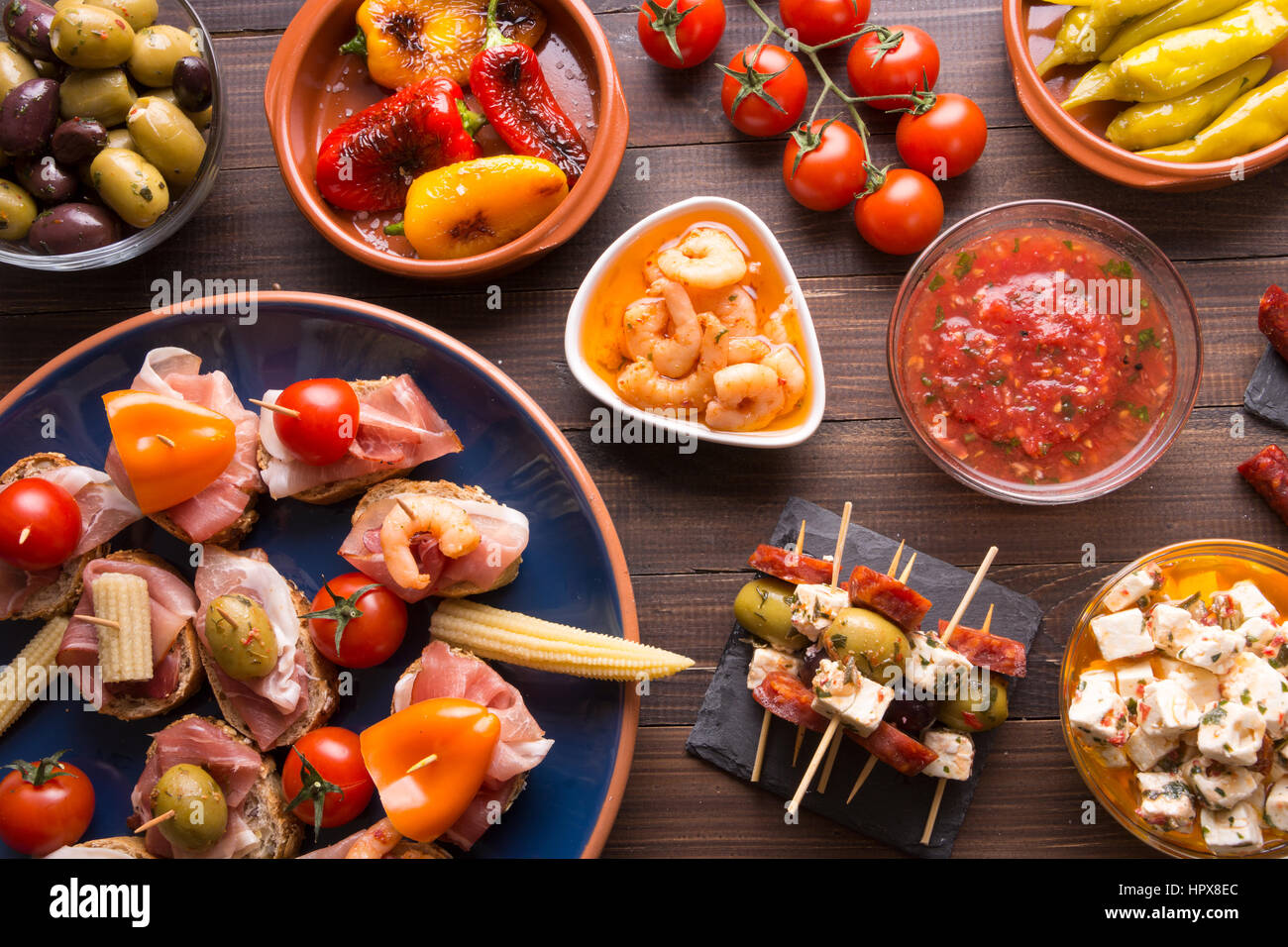 Spanish tapas starters on old wooden table. Top view Stock Photo - Alamy
