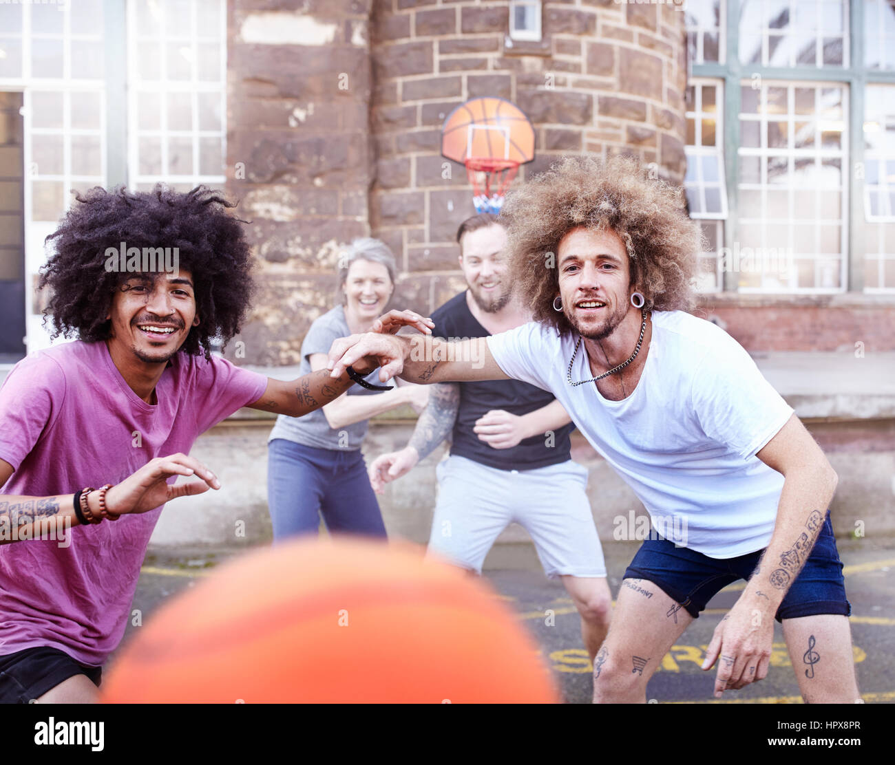Personal perspective friends playing basketball at urban basketball ...