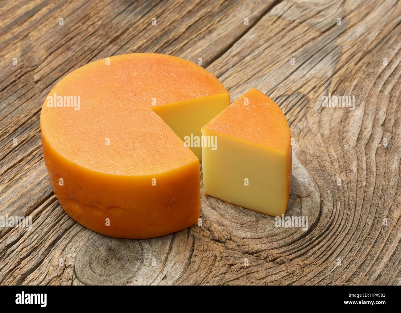 cheese on rustic wooden table Stock Photo - Alamy