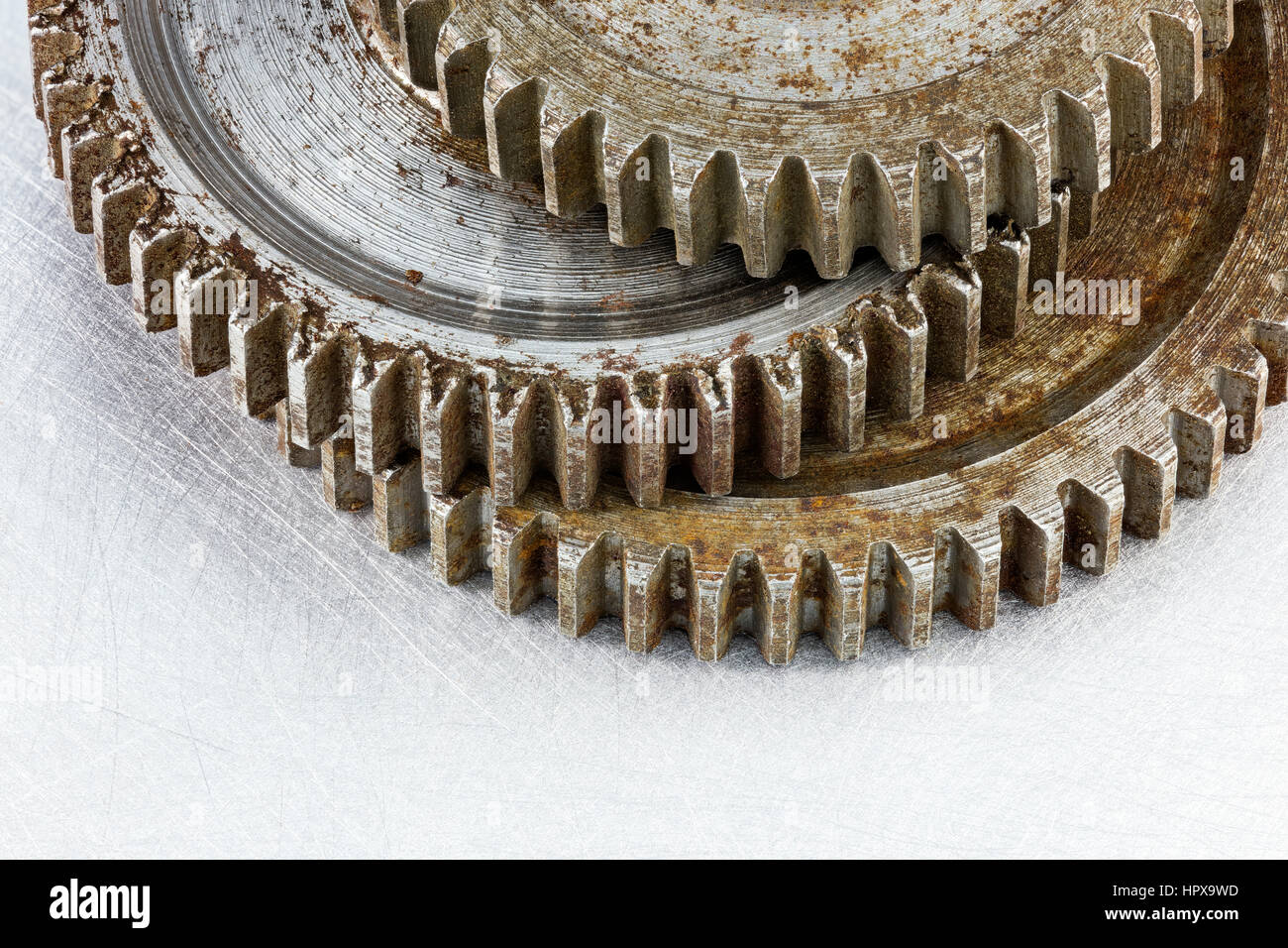 rusty weathered metal gears on scratched industrial background macro ...