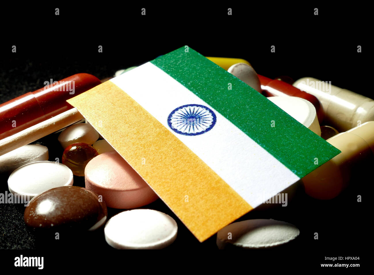 Indian flag with lot of medical pills isolated on black background ...
