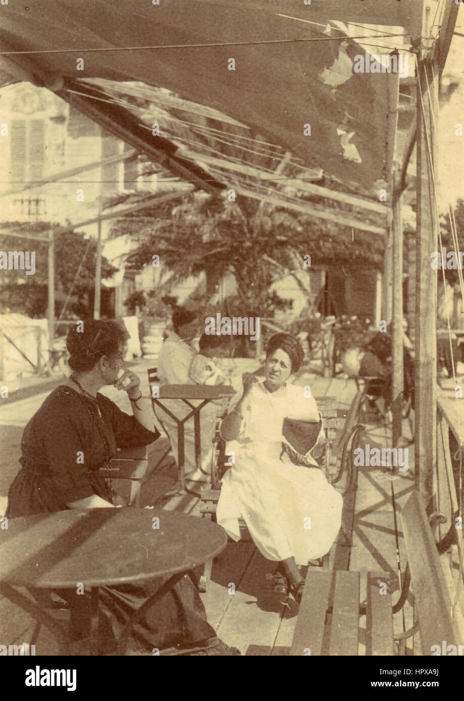 Two women sitting outside talking, Italy Stock Photo - Alamy Two women sitting outside talking, Italy Stock Photo - Alamy
