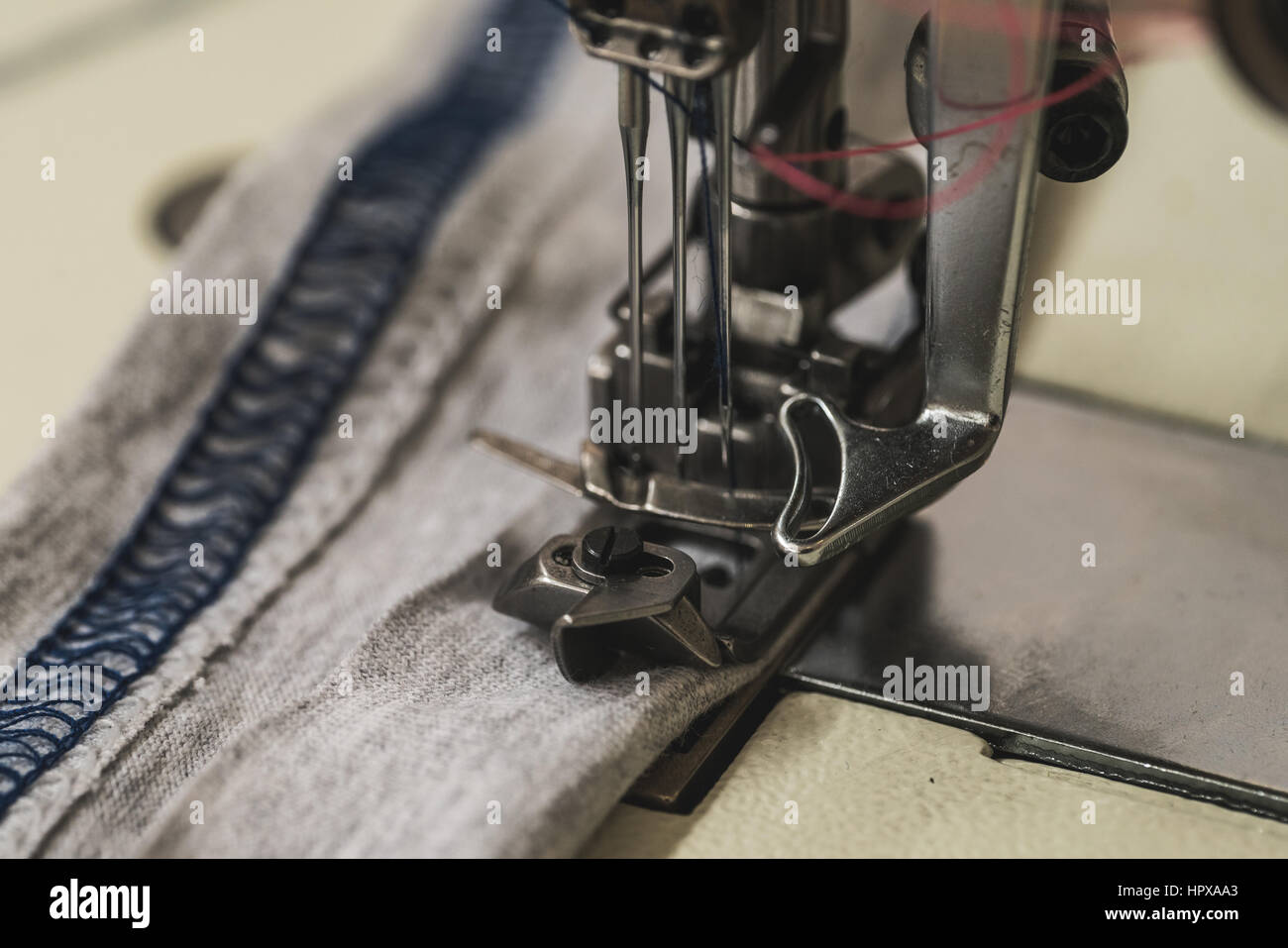 A close up shot of a sewing machine in use Stock Photo - Alamy