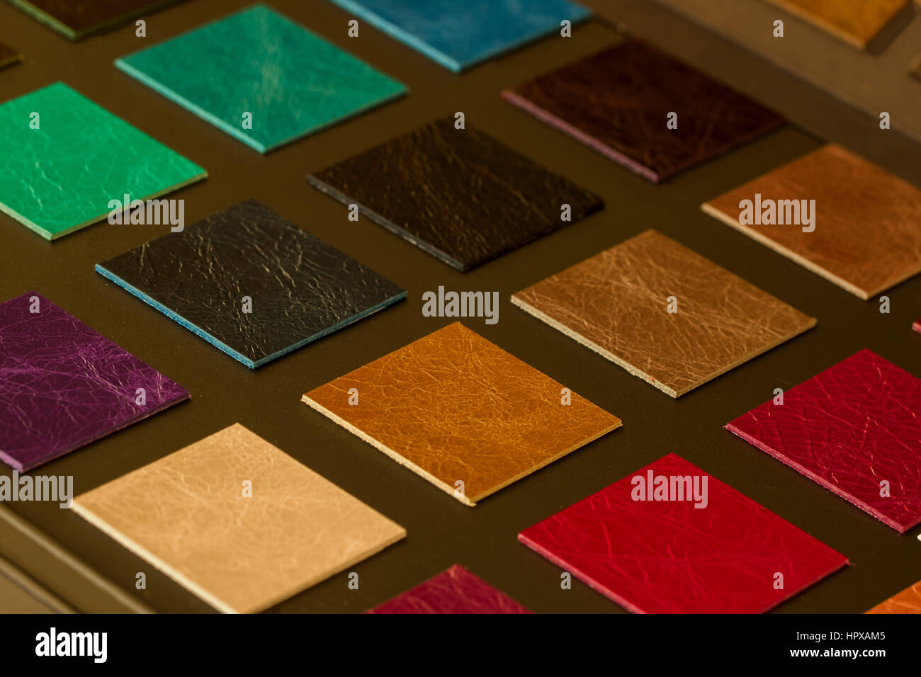 Leather samples. Samples of colorful palette on dark background for ...