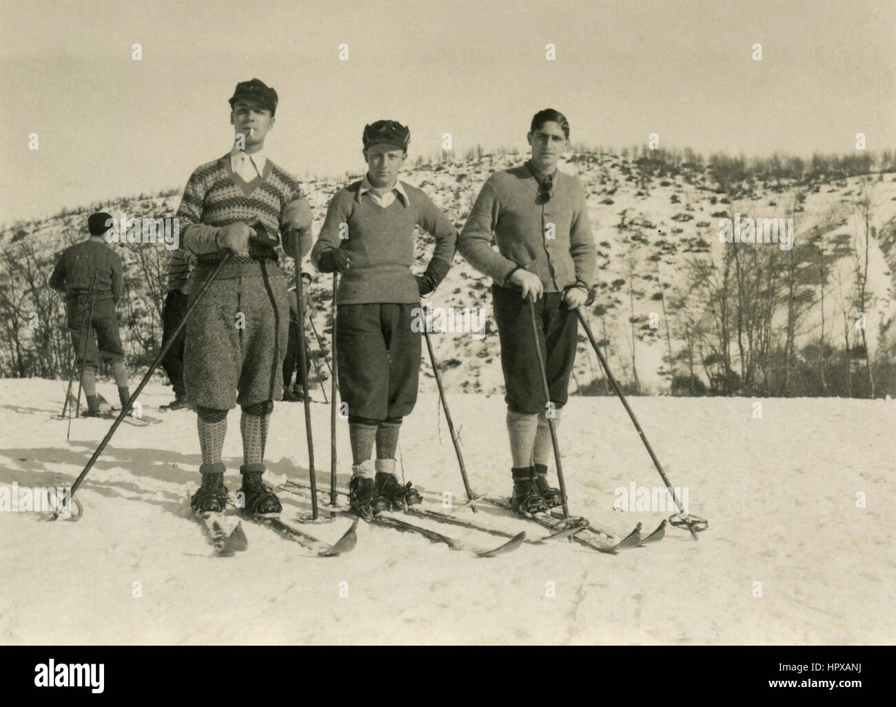 Three skiers, Italy Stock Photo - Alamy