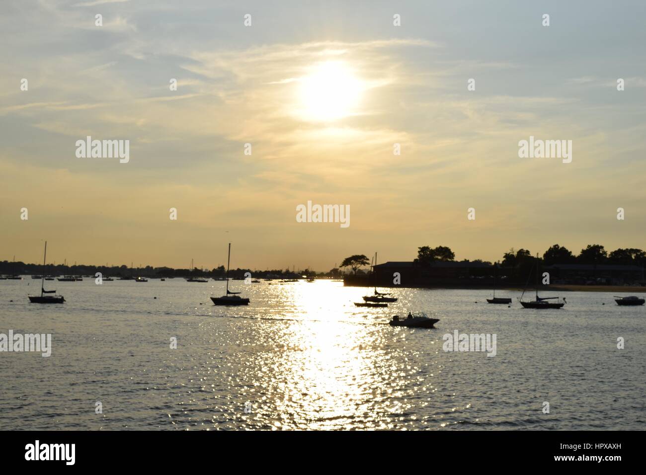 Sunset at the docks Stock Photo - Alamy