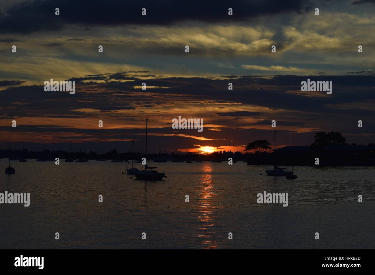 Sunset at the docks Stock Photo - Alamy