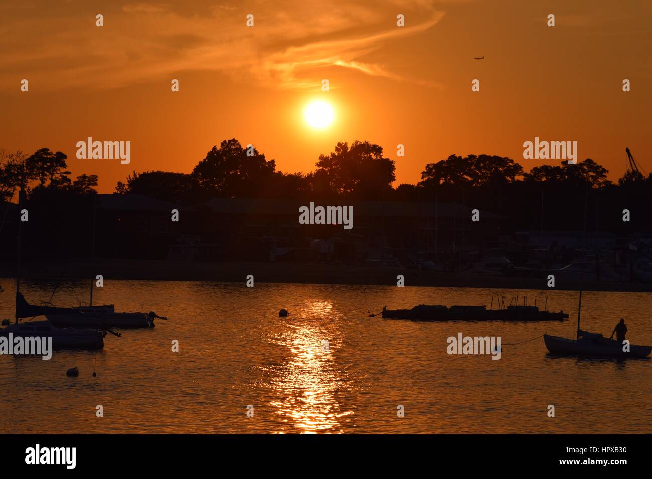 Sunset at the docks Stock Photo - Alamy