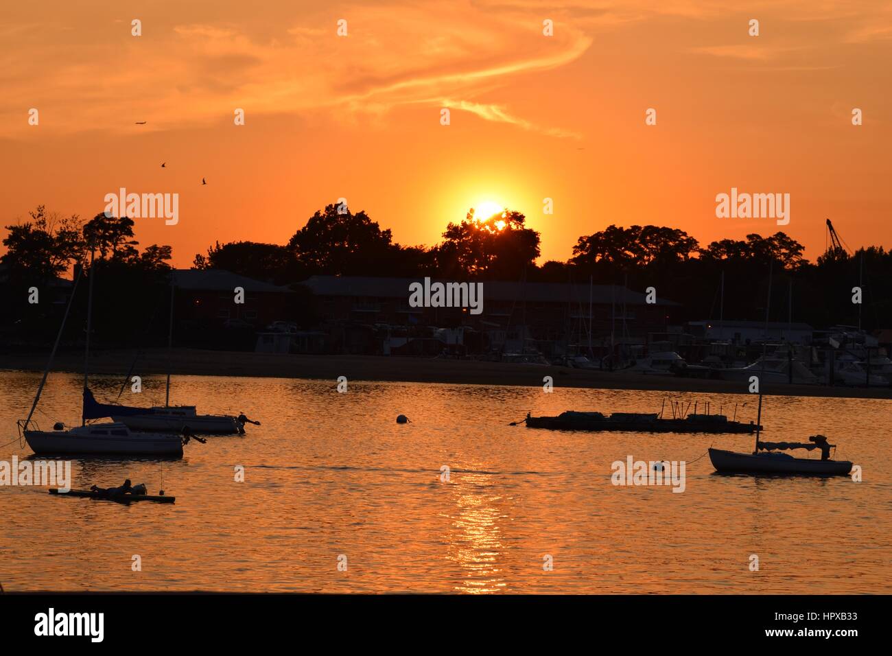 Sunset at the docks Stock Photo - Alamy