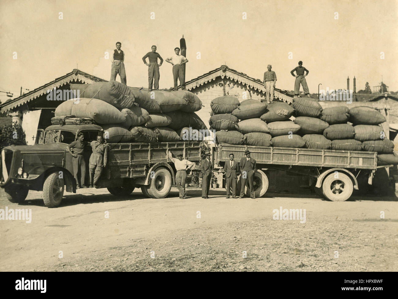 Handymen on top of a truck loaded with agricultural products, Italy ...
