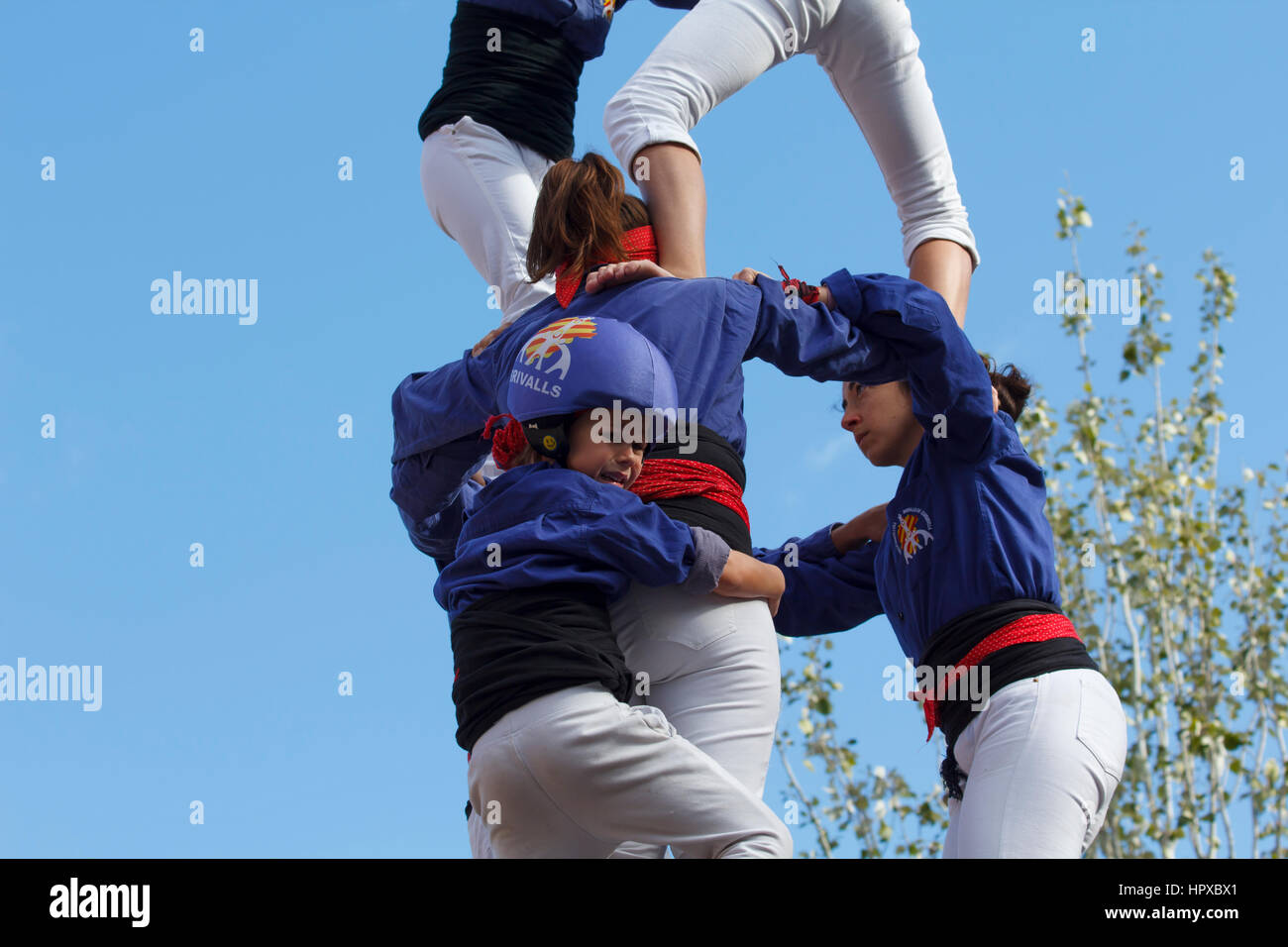 People making human towers, a traditional spectacle in Catalonia called ...