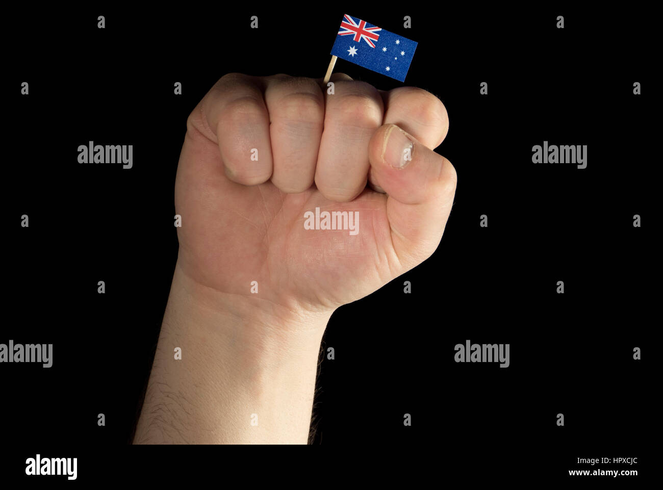Man hand fist with Australian flag isolated on black background Stock ...
