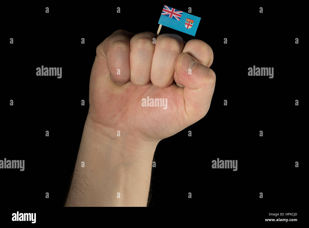 Man hand fist with Fijian flag isolated on black background Stock Photo ...
