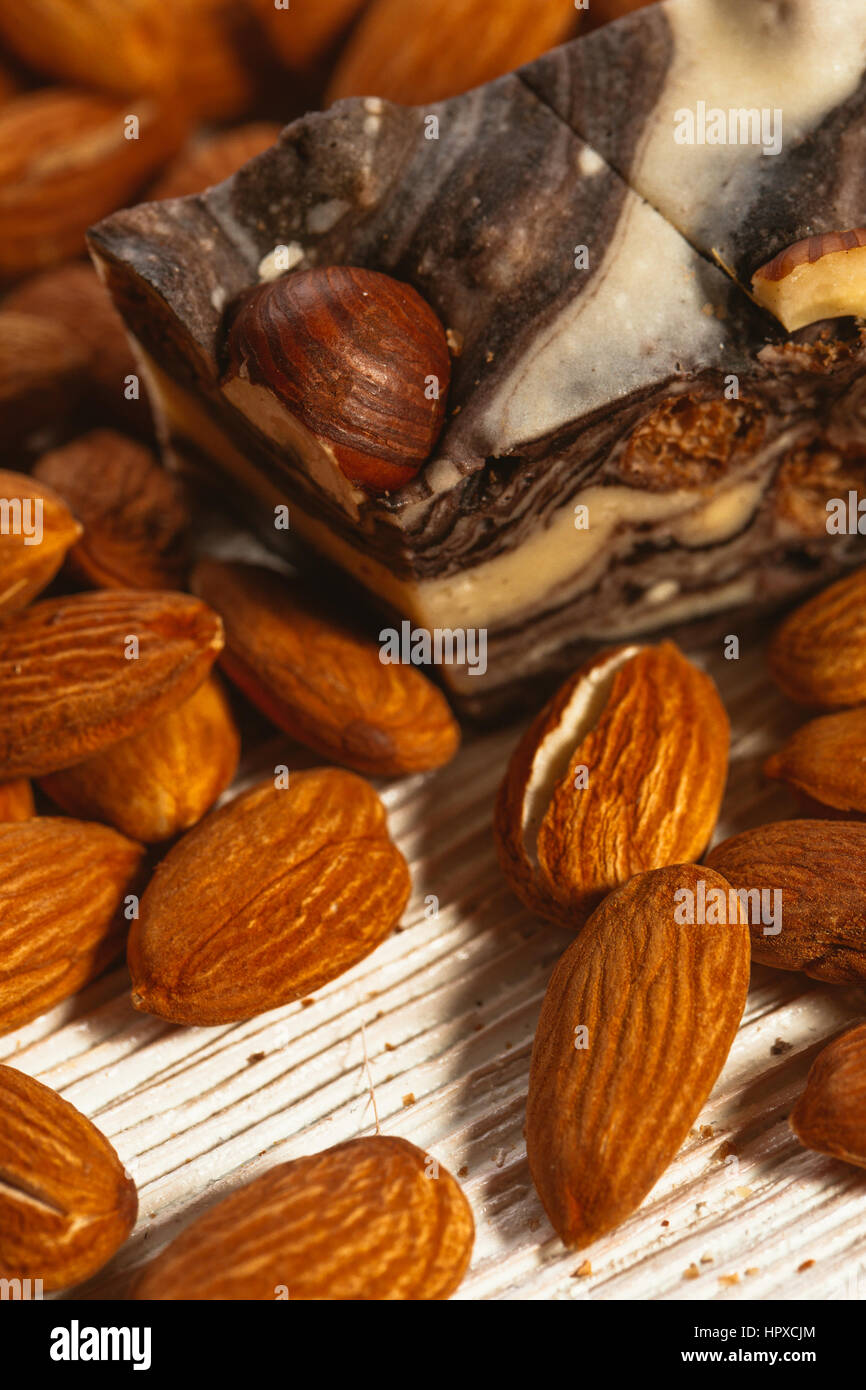 candy paste and almonds on white wooden background Stock Photo - Alamy