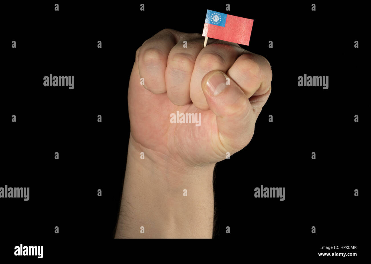 Man hand fist with Myanmar flag isolated on black background Stock ...