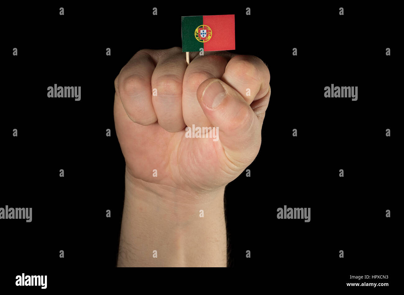 Man hand fist with Portuguese flag isolated on black background Stock ...