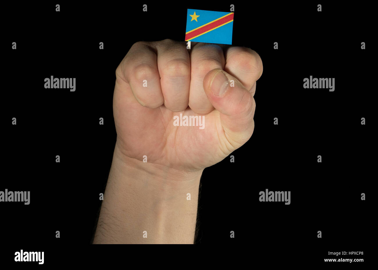 Man hand fist with Democratic Republic of Congo flag isolated on black ...