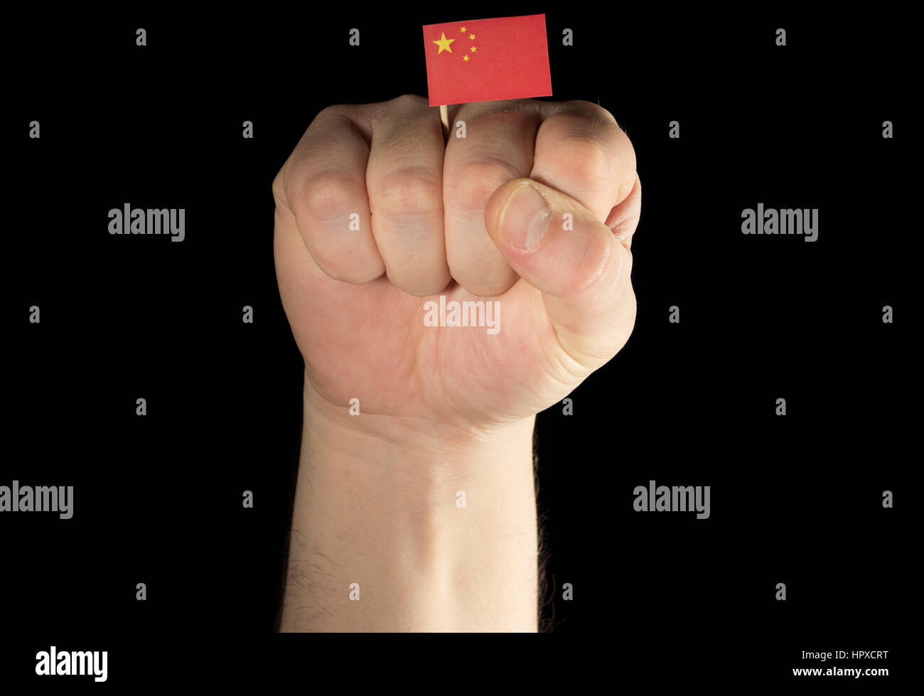 Man hand fist with Chinese flag isolated on black background Stock ...
