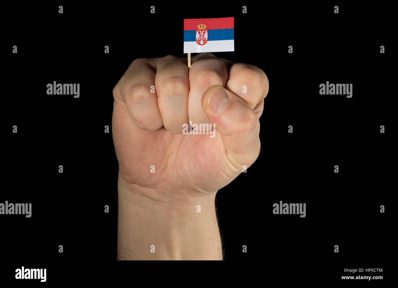 Man hand fist with Serbian flag isolated on black background Stock ...
