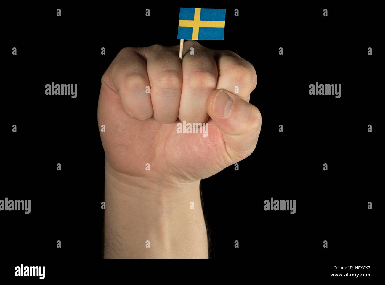 Man hand fist with Swedish flag isolated on black background Stock ...