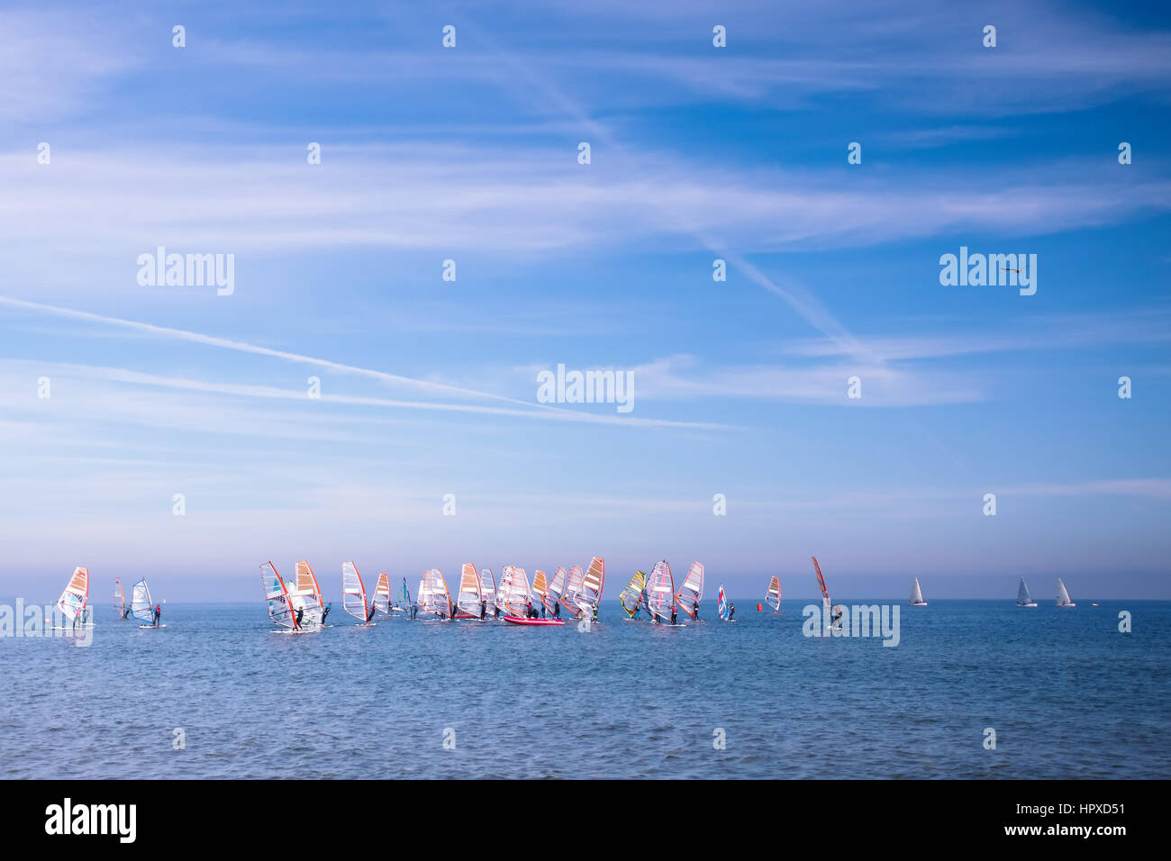 Sailing ship yachts with color sails in a row Stock Photo - Alamy