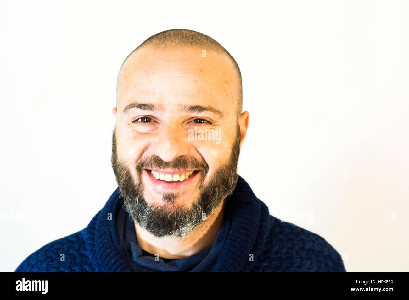Handsome, bald man with beard on white background Stock Photo - Alamy