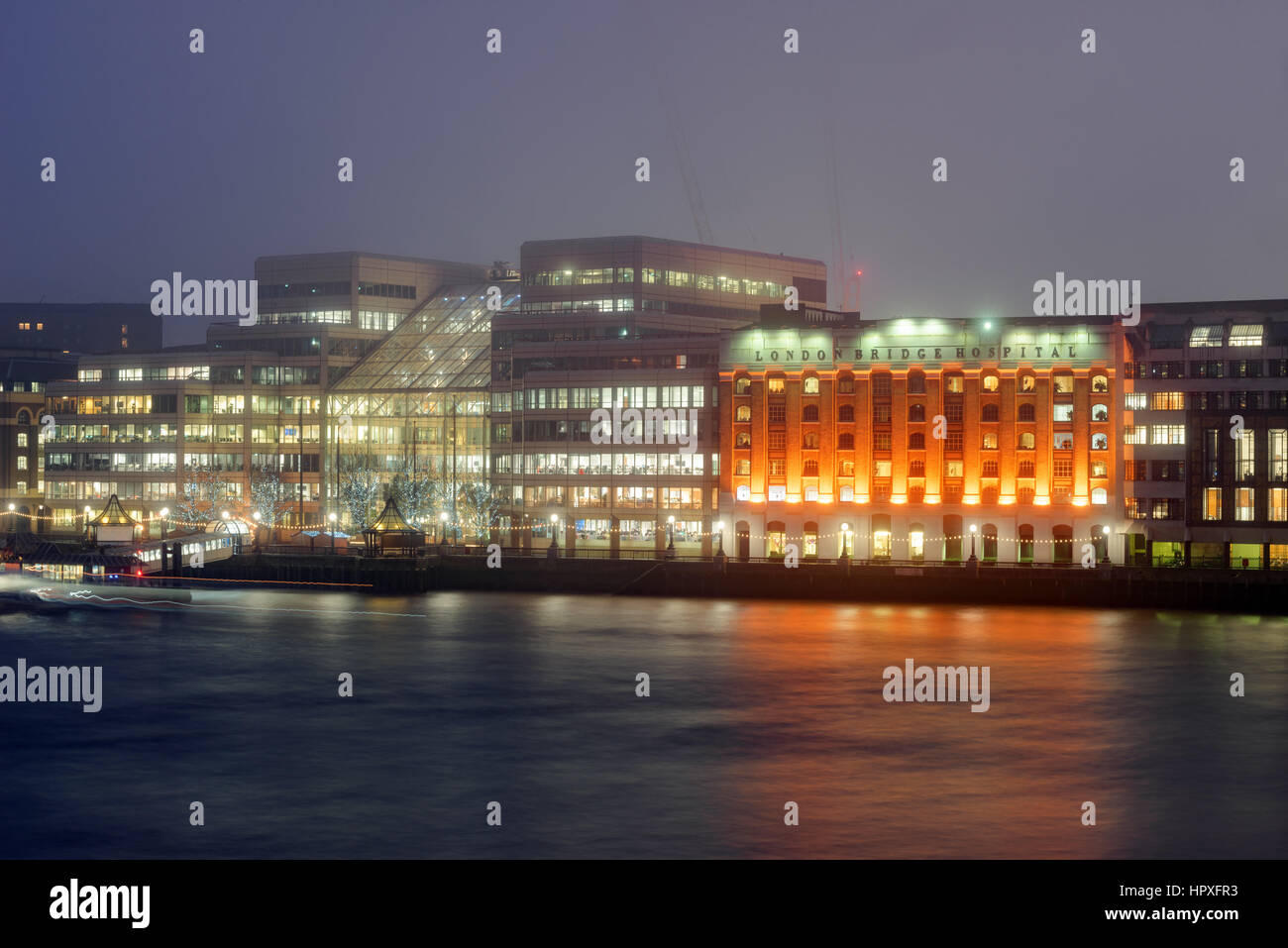 Illuminated buildings by the River Thames in central London Stock Photo ...