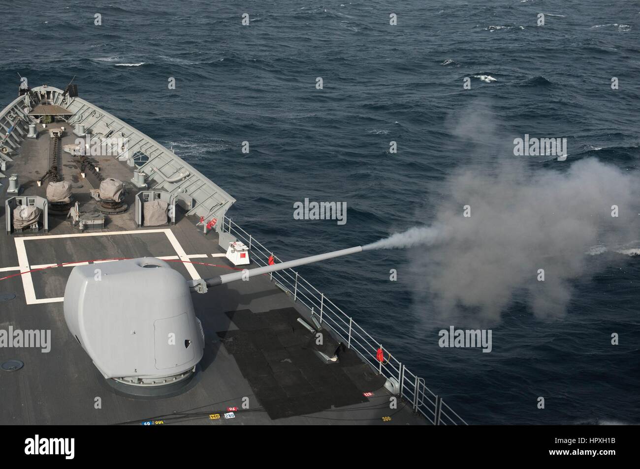 Guided-missile cruiser USS Mobile Bay (CG 53) fires its 5-inch gun ...