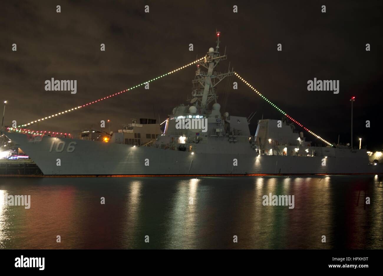 Guided-missile destroyer USS Stockdale (DDG 106) covered in holiday ...