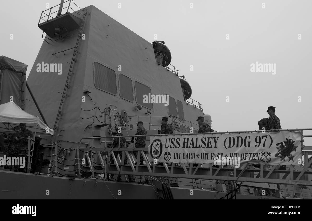 Sailors assigned to the USS Halsey board the ship, January 25, 2013 ...