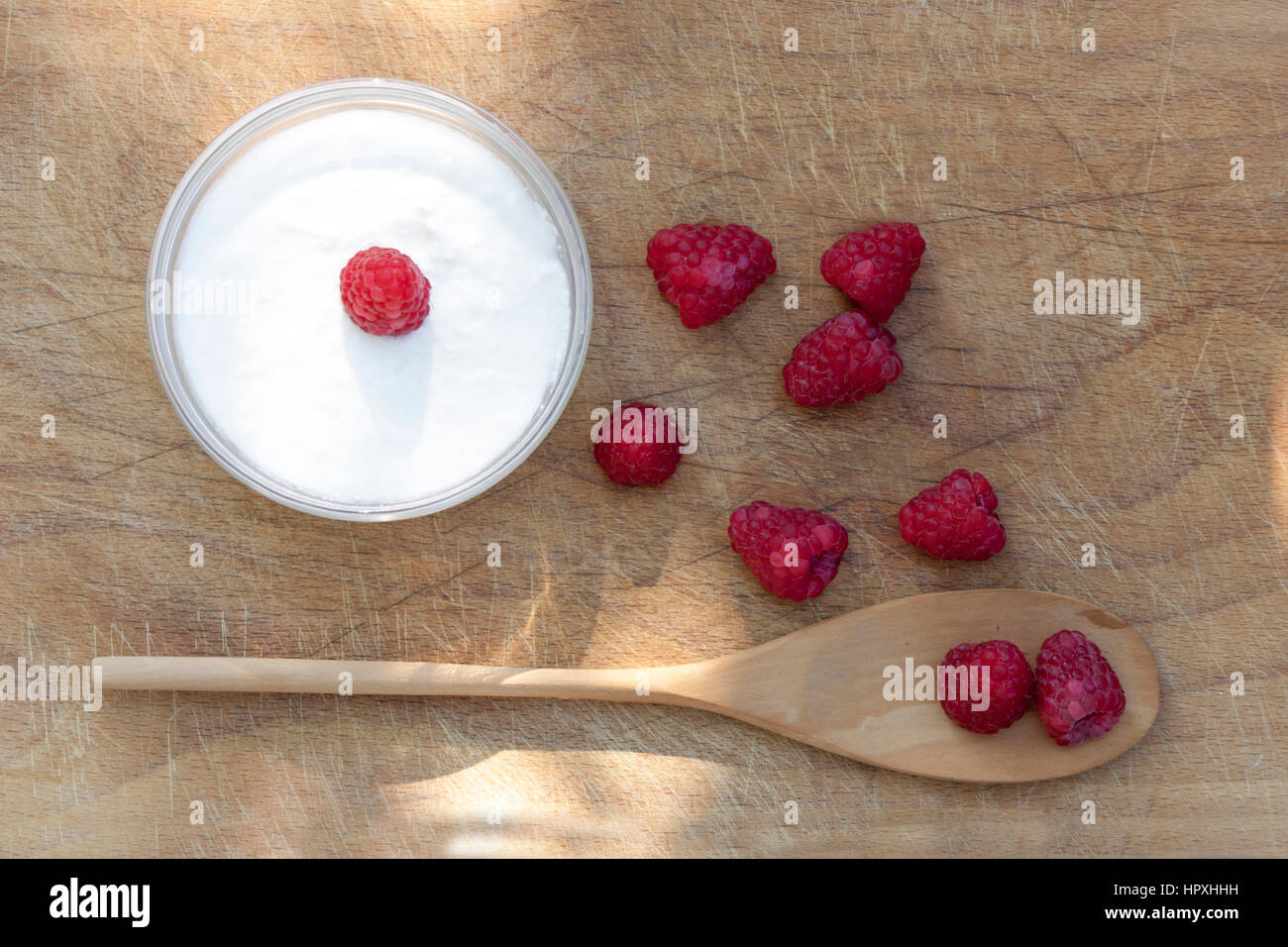 Yogurt with raspberries Stock Photo - Alamy