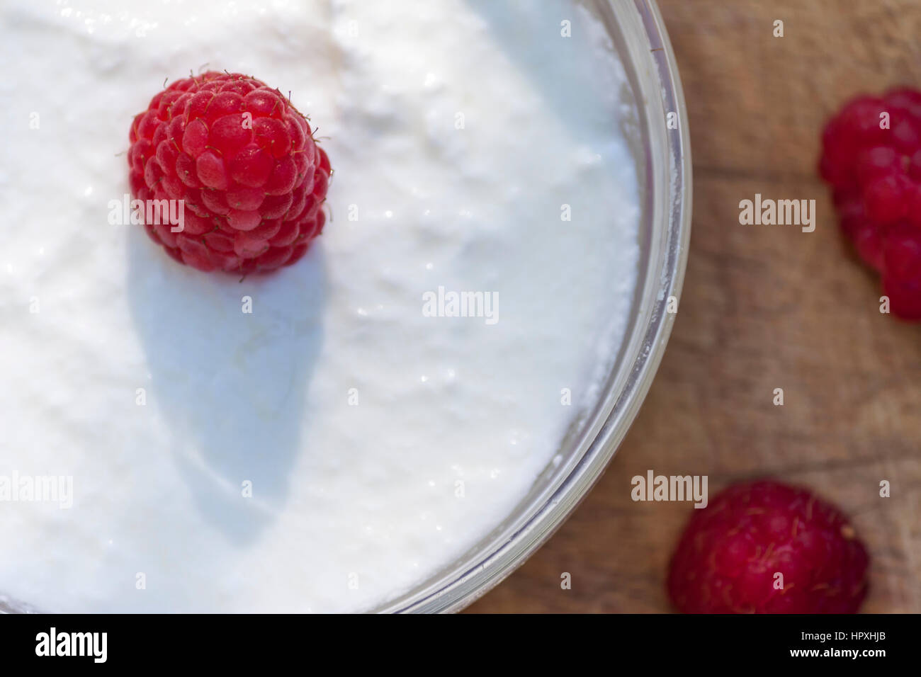 Yogurt with raspberries Stock Photo - Alamy