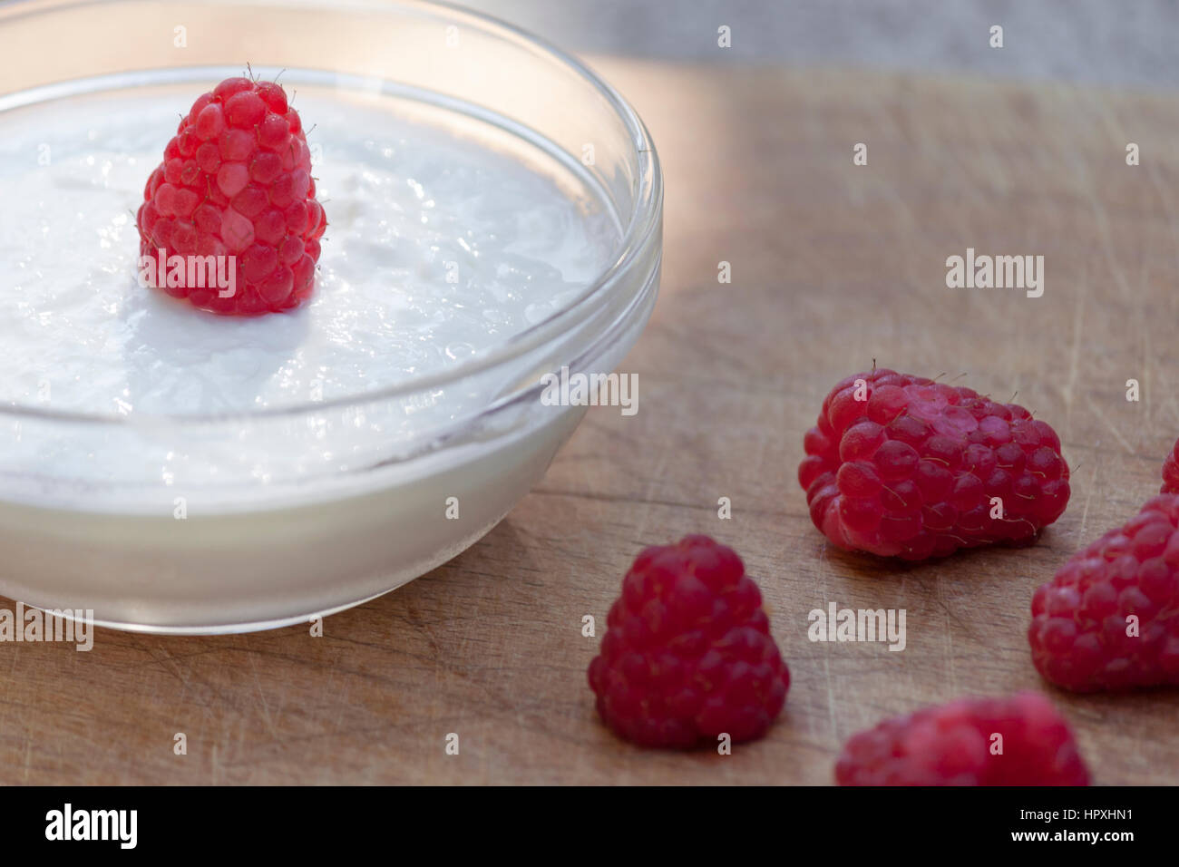 Yogurt with raspberries Stock Photo - Alamy