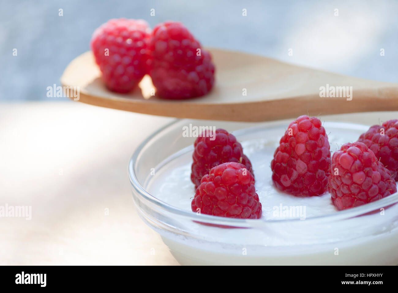 Yogurt with raspberries Stock Photo - Alamy