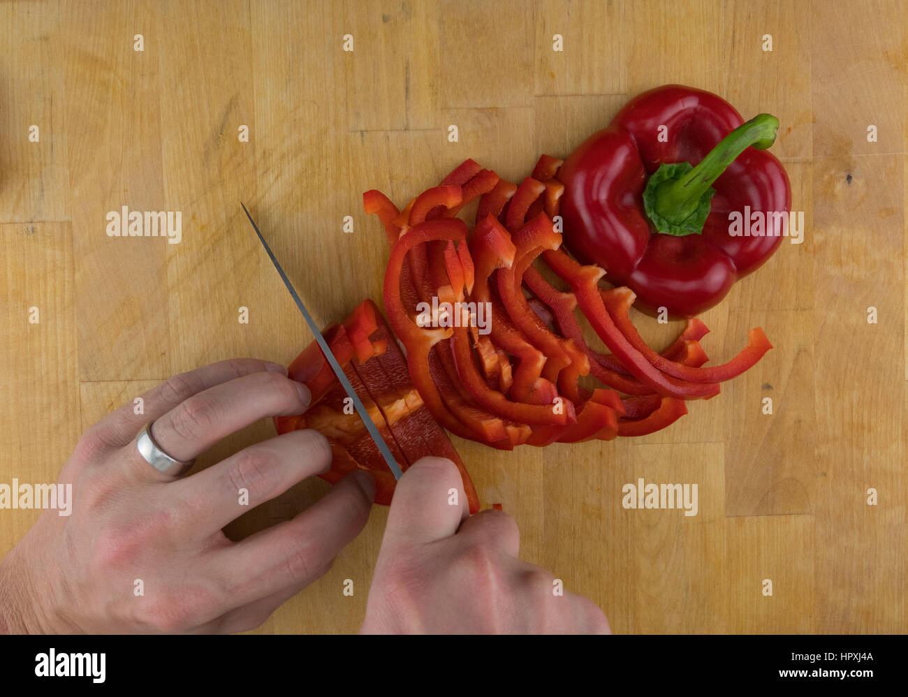 Above View of Hands Cutting Red Pepper into thin strips Stock Photo - Alamy