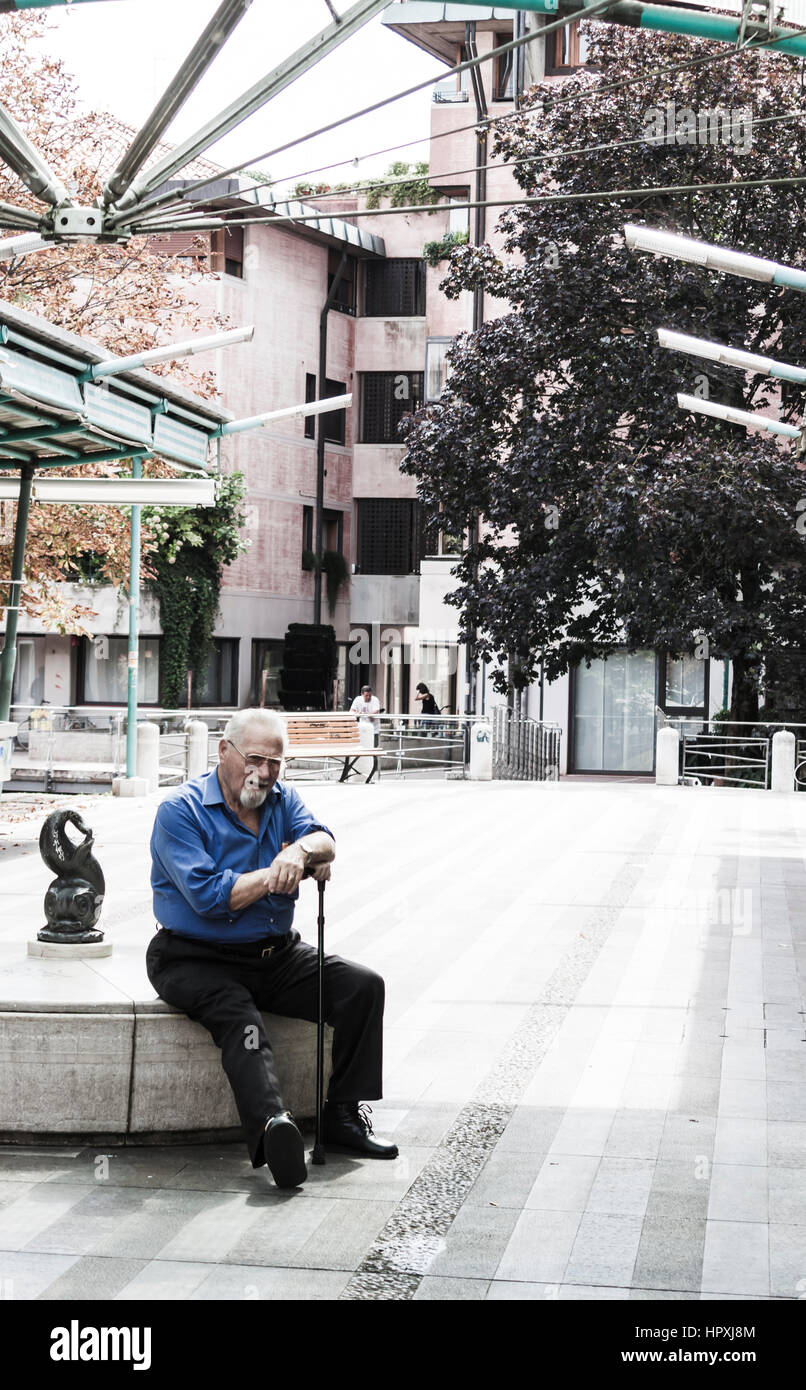 Old man sitting and resting Stock Photo - Alamy