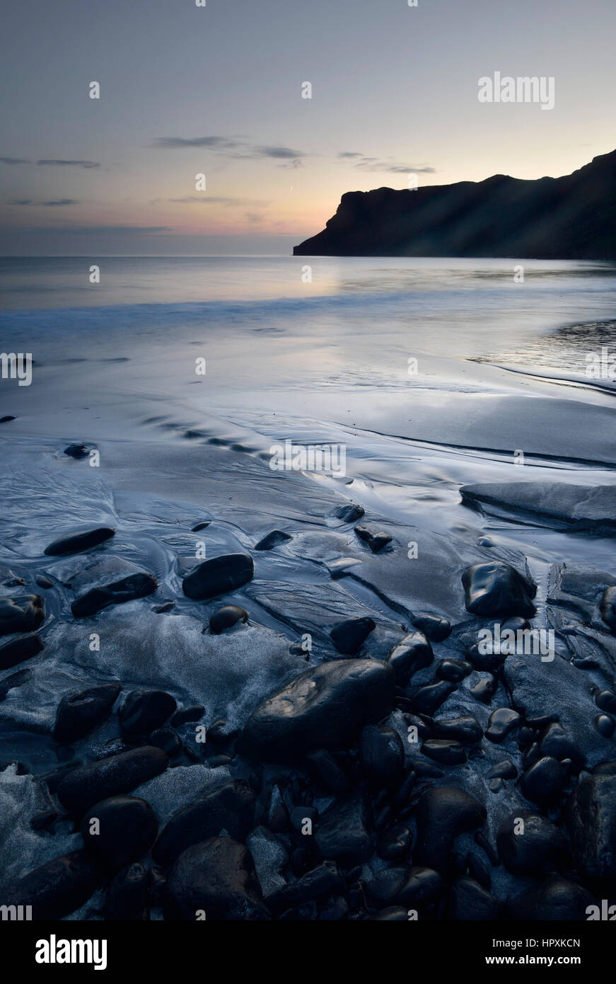 Stones in the sand on the beach of Talisker Bay, Isle of Skye, Scotland ...