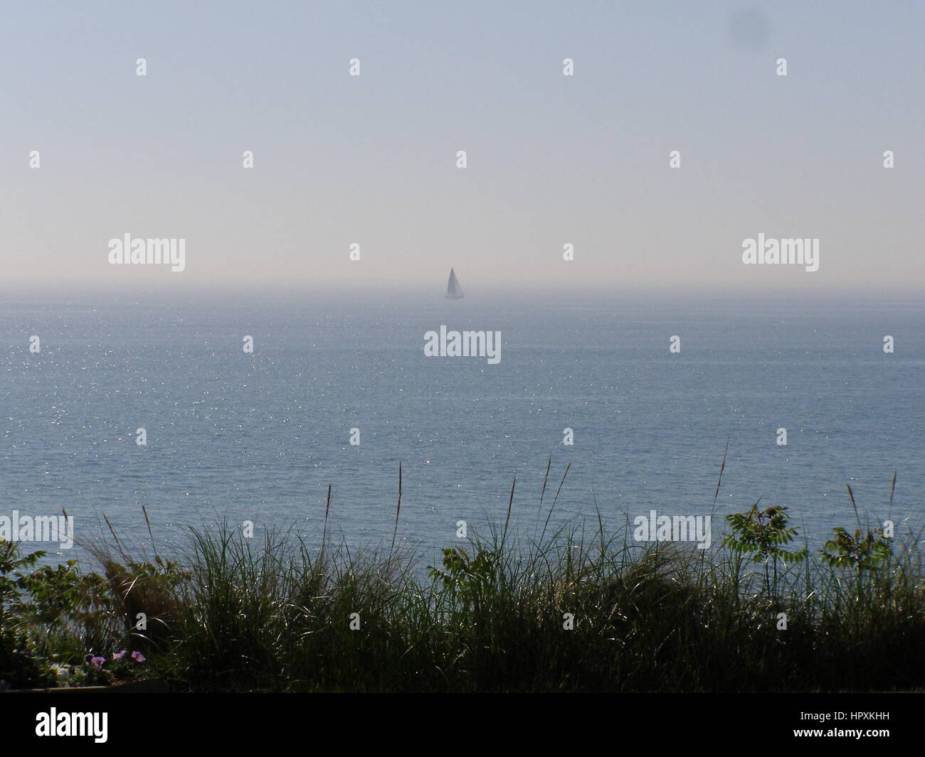 Boat on the Horizon Stock Photo - Alamy