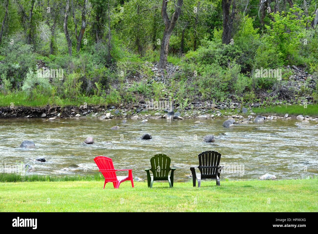 Chairs by a River Stock Photo - Alamy