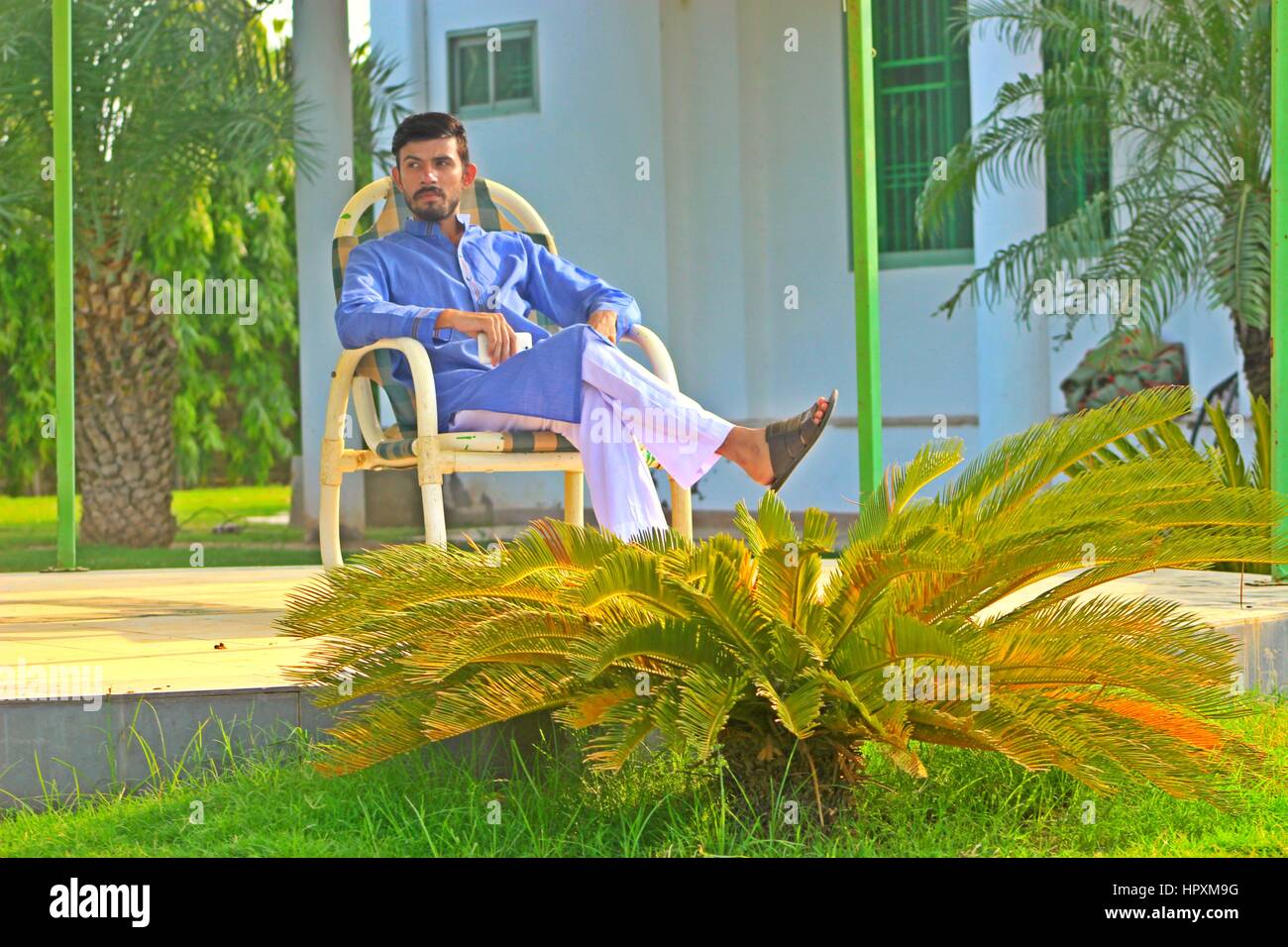 Boy Sitting On Chair in Happy mood Stock Photo - Alamy