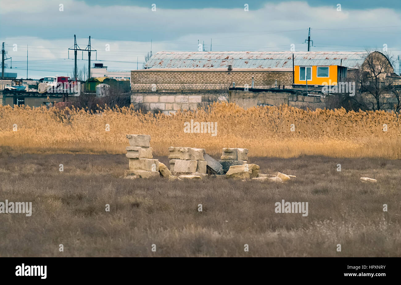 Building materials on an empty field near the industrial base Stock ...