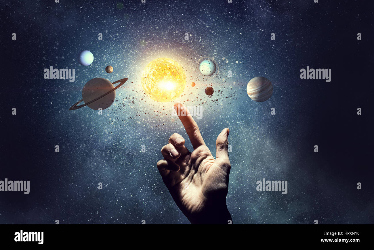 Close up of human hand pointing at planet sun system Stock Photo - Alamy