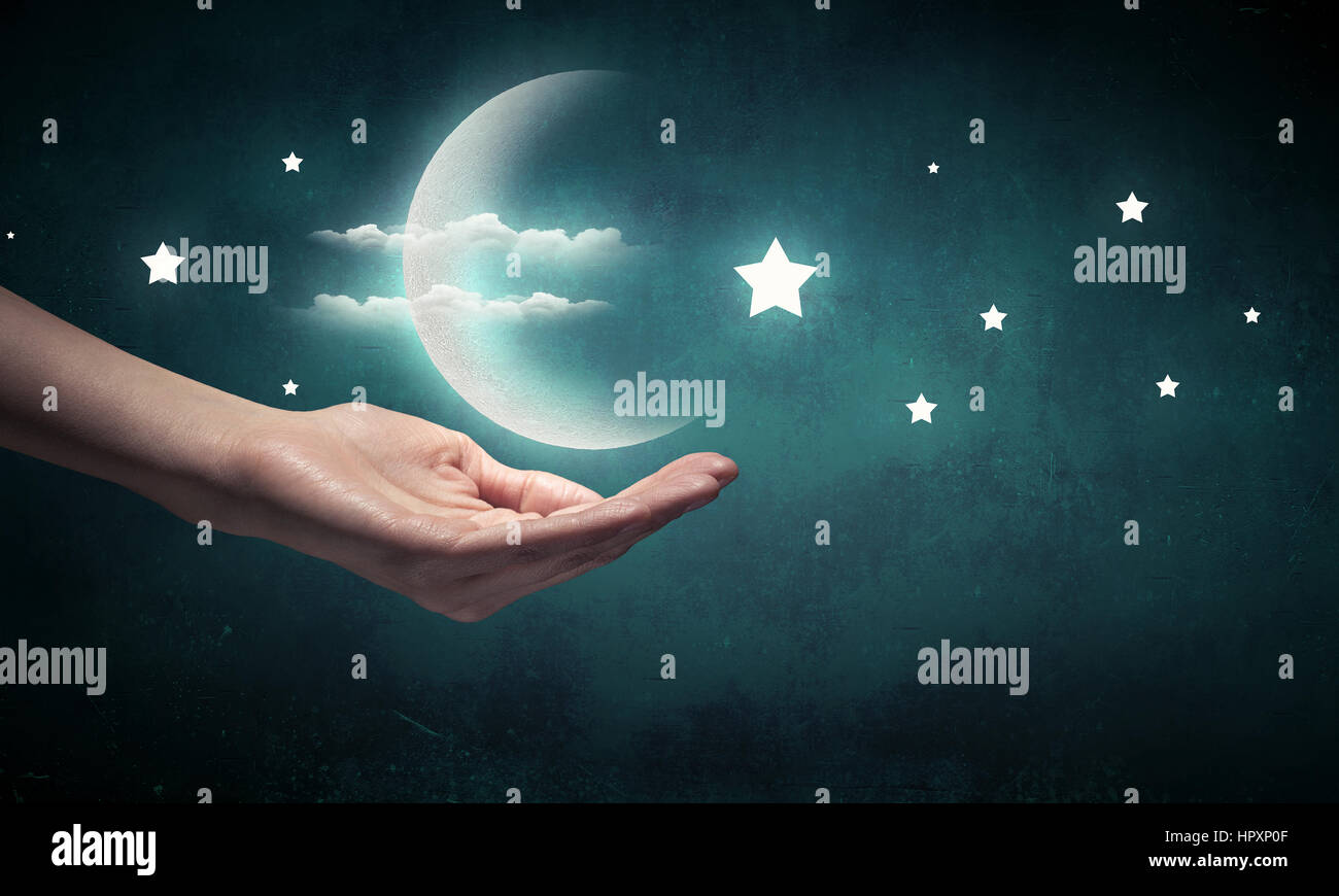 Human hand holding moon planet in palm Stock Photo - Alamy