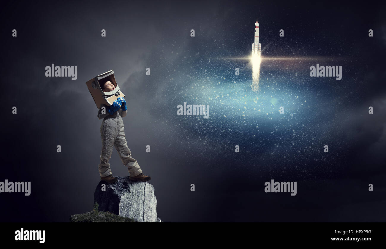 Cute girl in astronaut suit dreaming to explore space. Mixed media ...